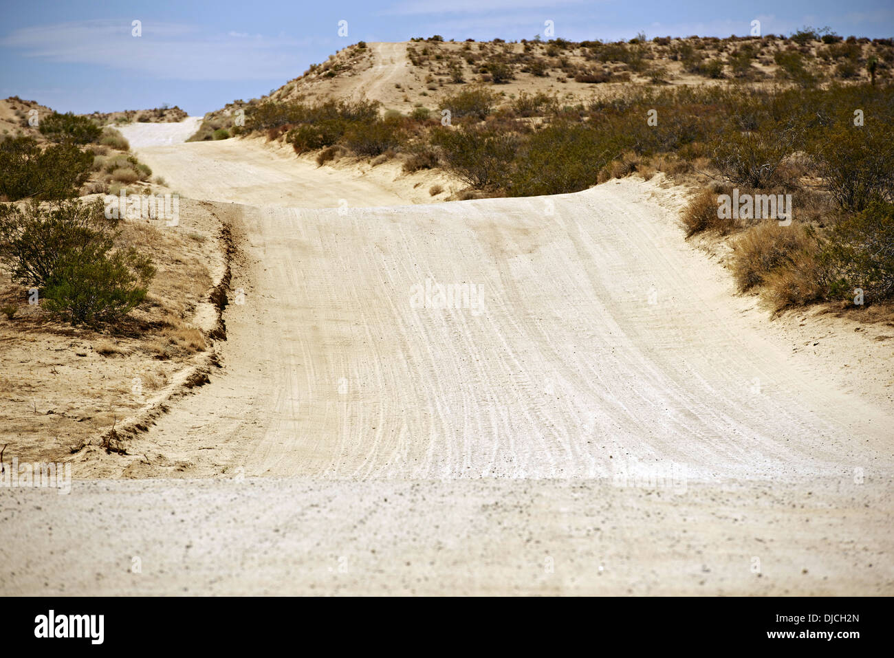 Sandy Desert Road in Mojave Desert, California, United States. Back ...