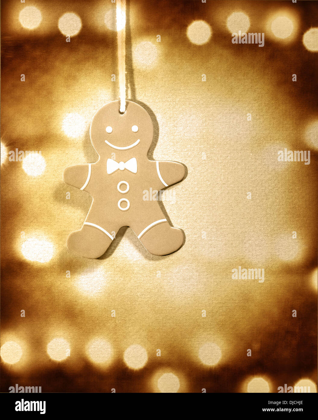 Gingerbread man hanging on brown glowing background, traditional ...