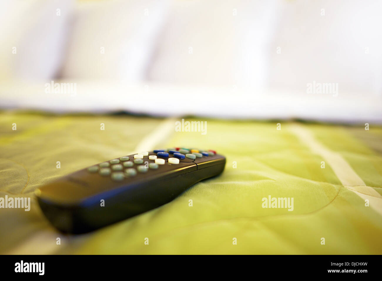 Black Television Remote on Bed. TV Watching Time Stock Photo - Alamy