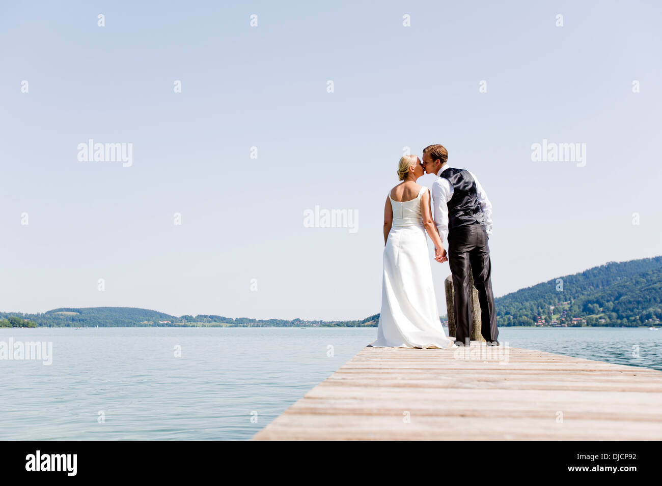 Couple kissing on jetty hi-res stock photography and images - Alamy