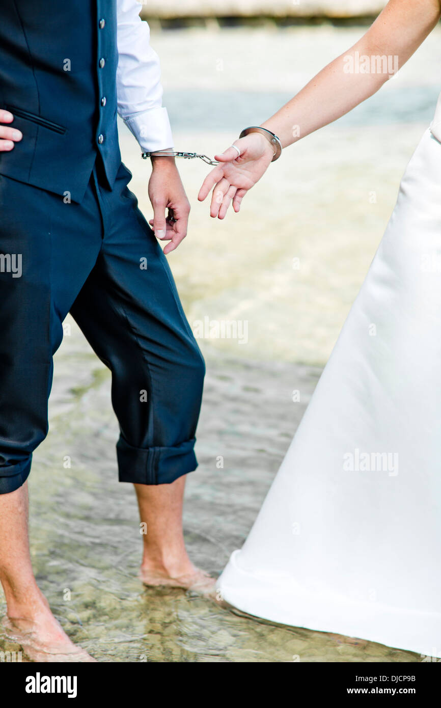 Germany, Bavaria, Tegernsee, Wedding couple standing in lake, wearing ...