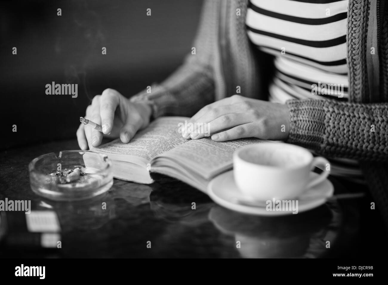 Woman smoking cigarette hi-res stock photography and images - Alamy