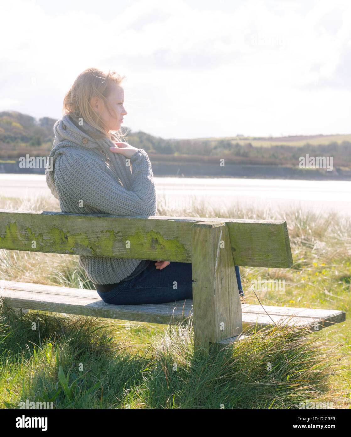 Pretty woman sitting on bench hi-res stock photography and images - Alamy