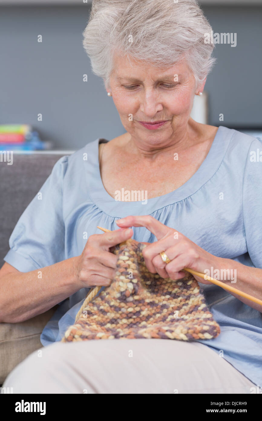 Mature woman knitting wool Stock Photo - Alamy