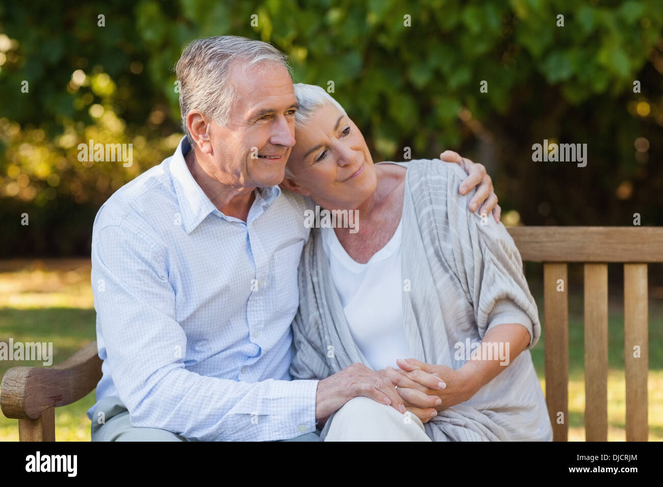 Elderly couple hugging Stock Photo - Alamy
