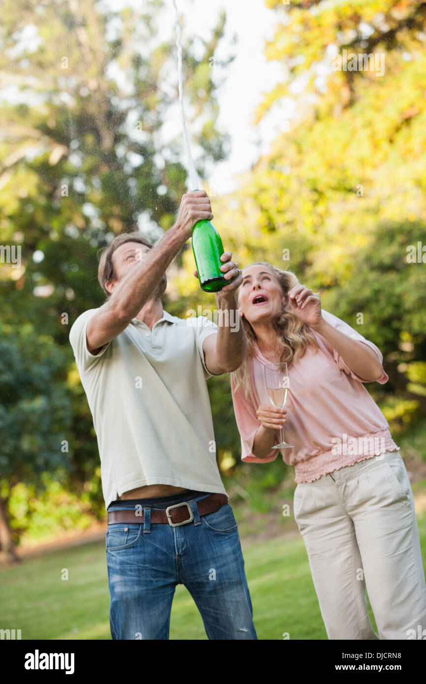 Couple champagne spraying bottle hi-res stock photography and images ...