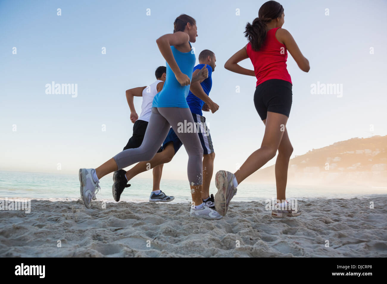 Young friends jogging together hi-res stock photography and images - Alamy