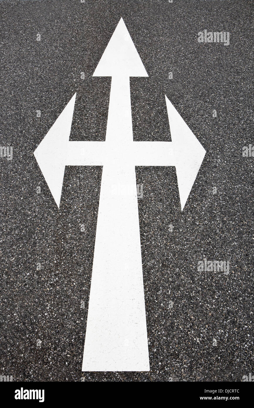Arrow signs on the road Stock Photo - Alamy