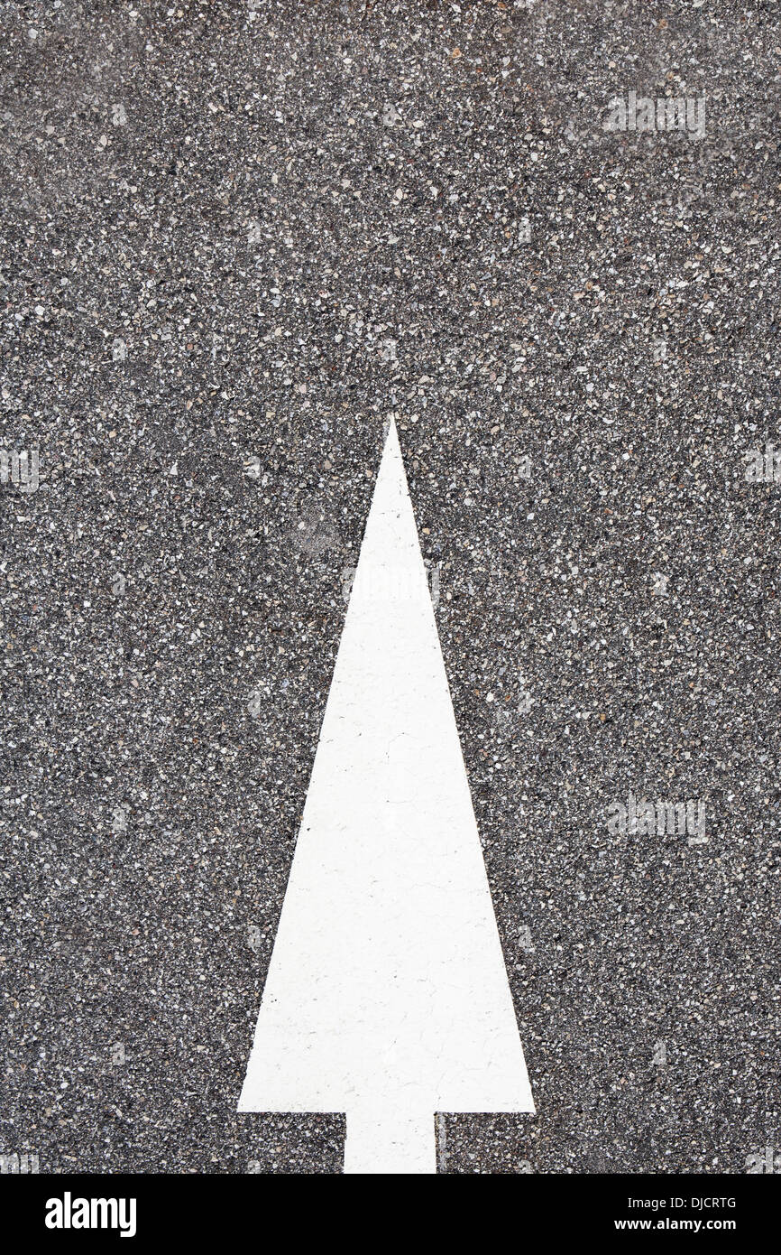 Arrow sign on the road Stock Photo - Alamy