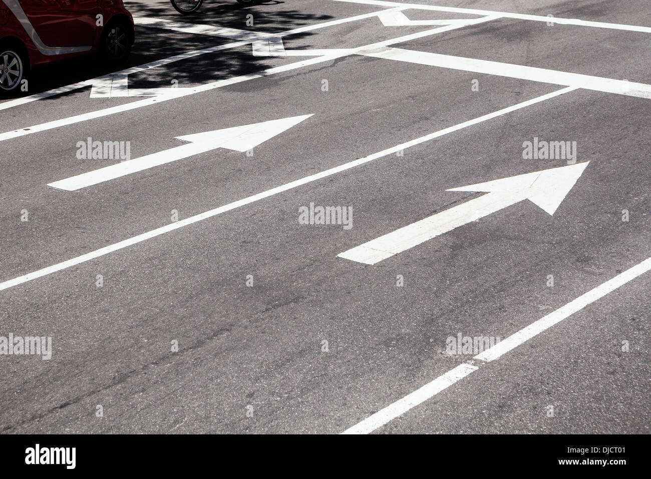 Arrow signs on the road Stock Photo - Alamy