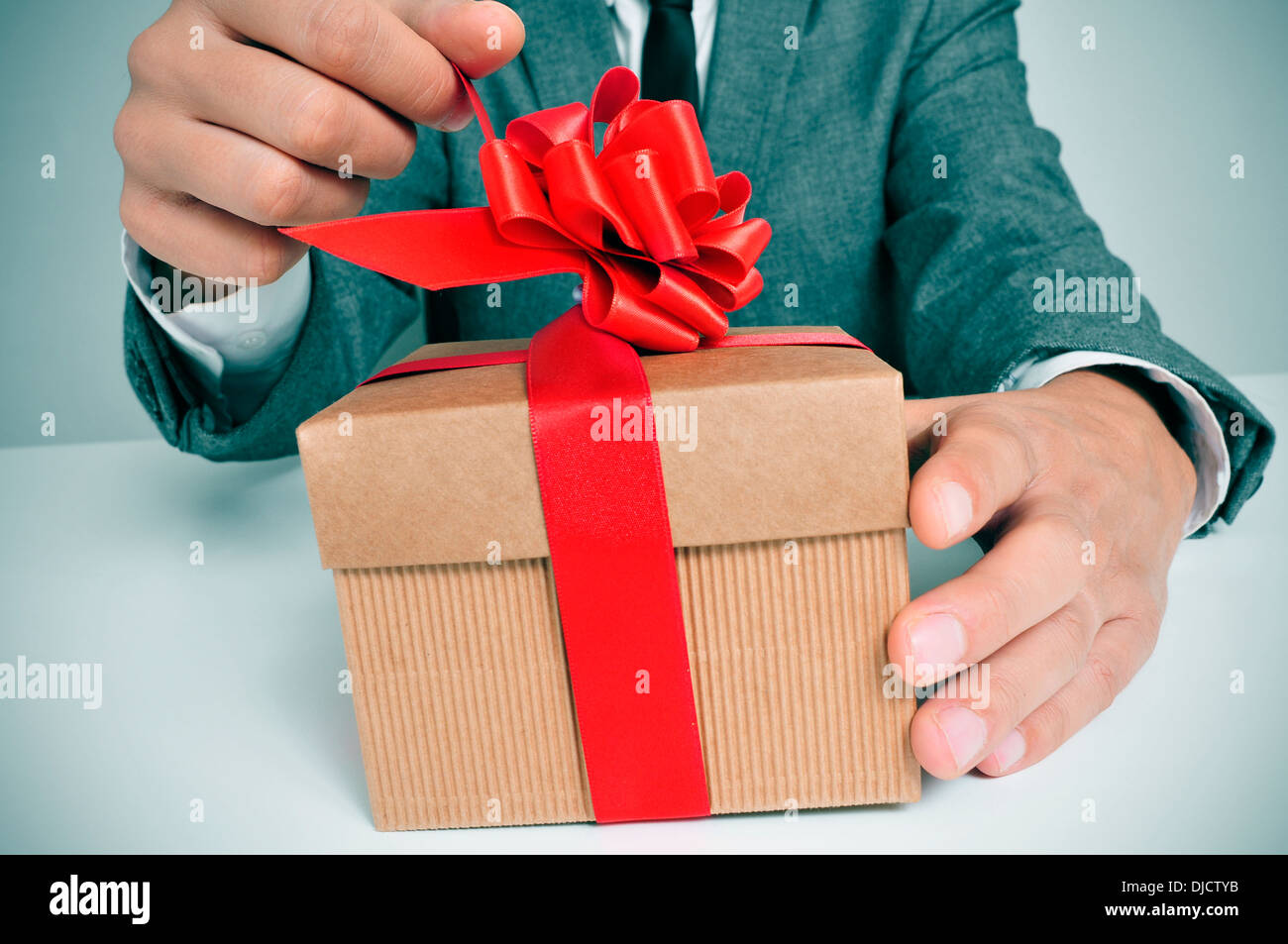 Businessman opening a box hi-res stock photography and images - Alamy