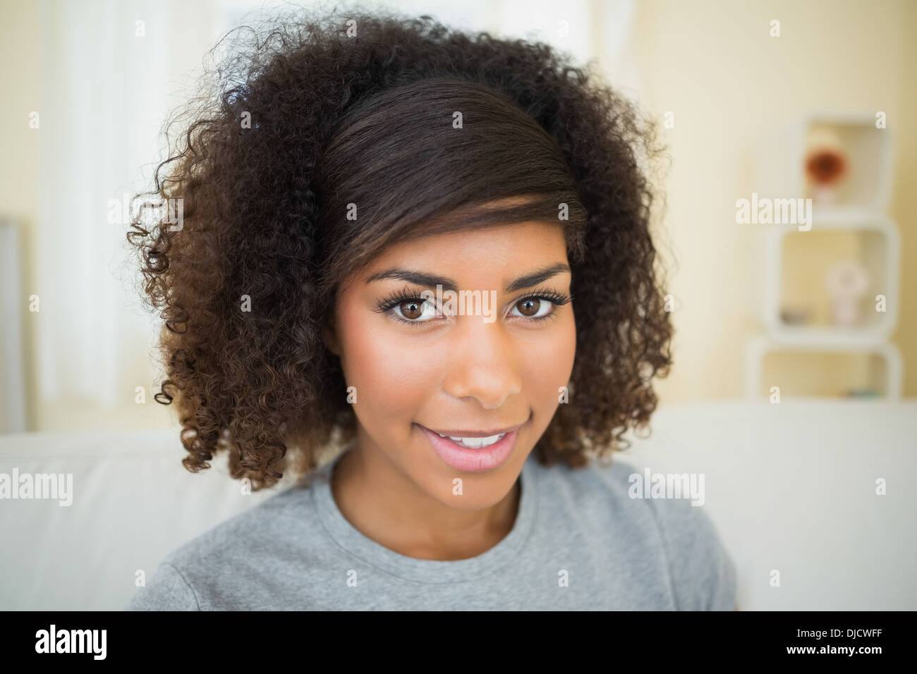 Smiling pretty woman brown curly hair hi-res stock photography and images - Alamy
