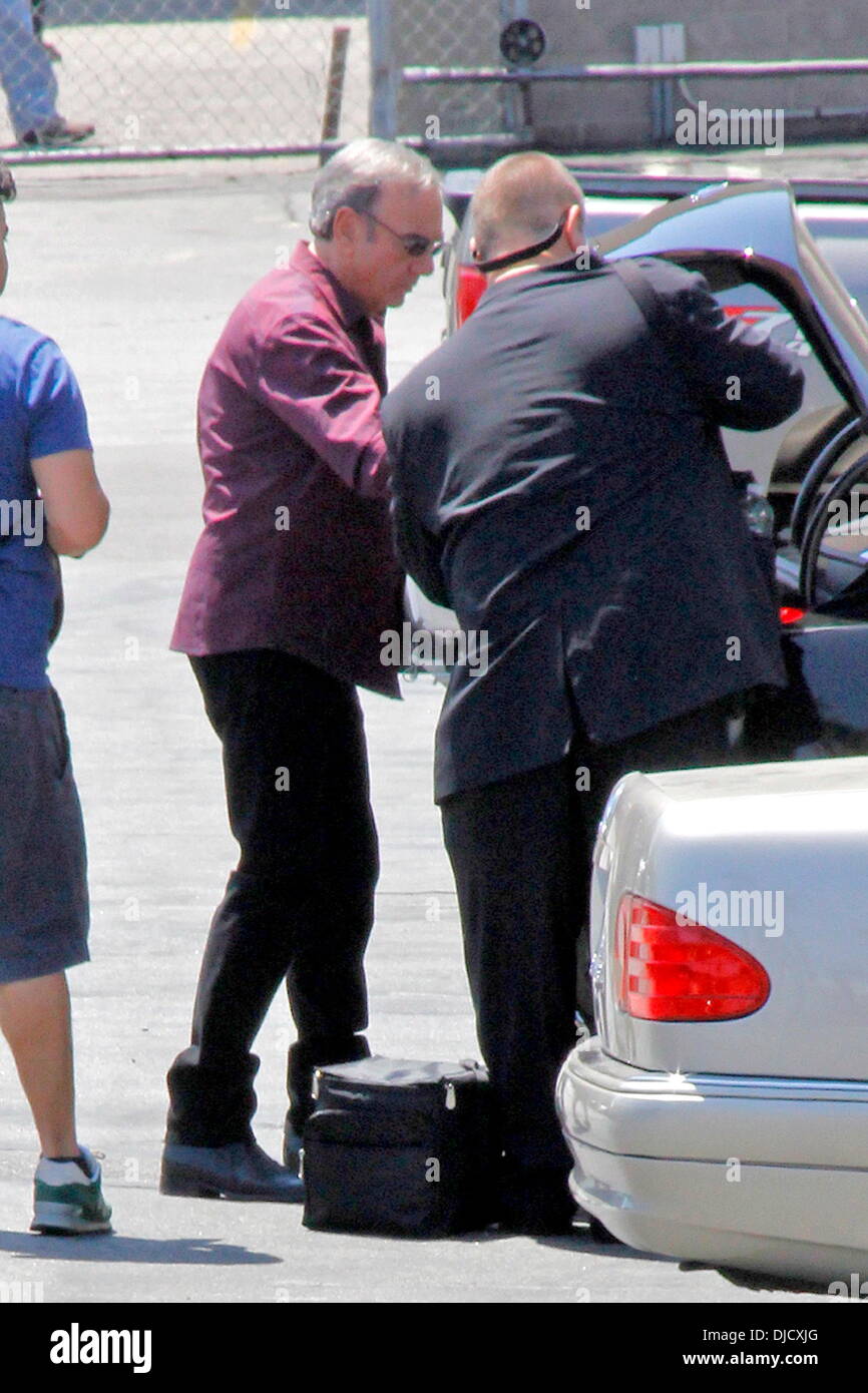 Neil Diamond returns to his car, after being honoured with a star on ...