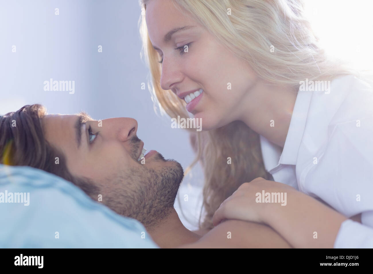 Peaceful couple lying in their bed Stock Photo - Alamy