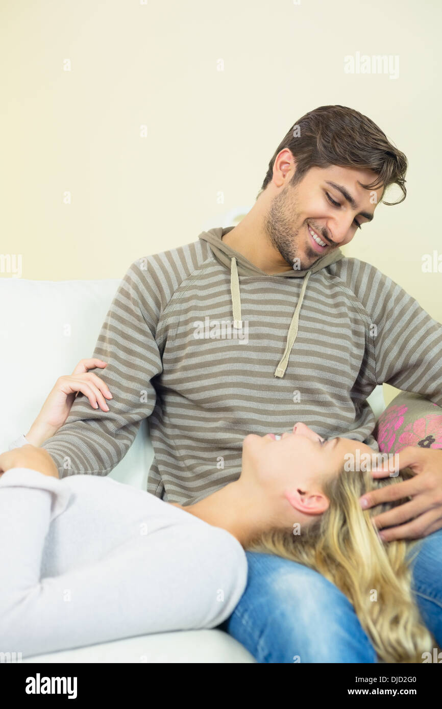 Beautiful young woman cuddling with her boyfriend Stock Photo - Alamy