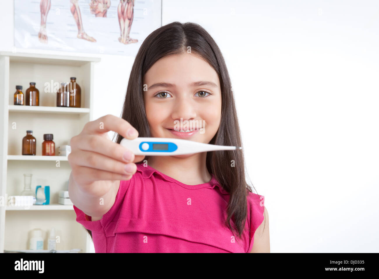 Girl Showing Thermometer in Clinic Stock Photo - Alamy