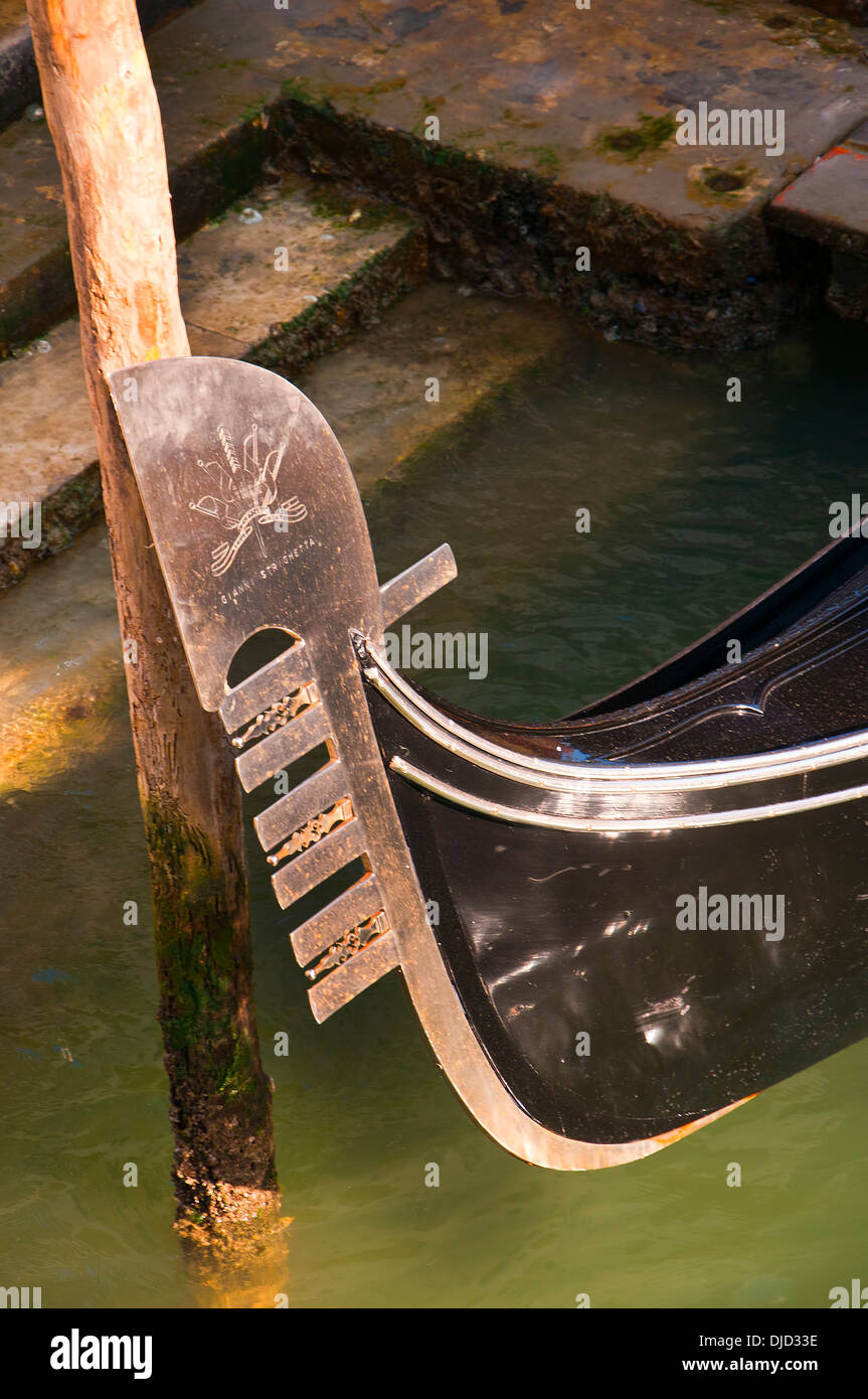 One end of a traditional Gondola in Venice Italy. The shape denotes ...