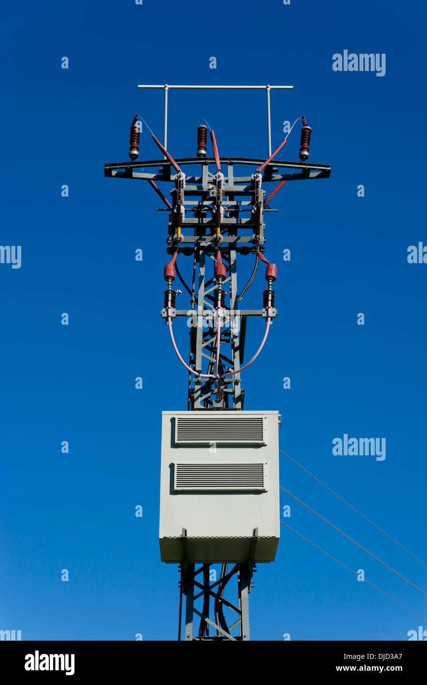 Power pylon under blue sky Stock Photo - Alamy