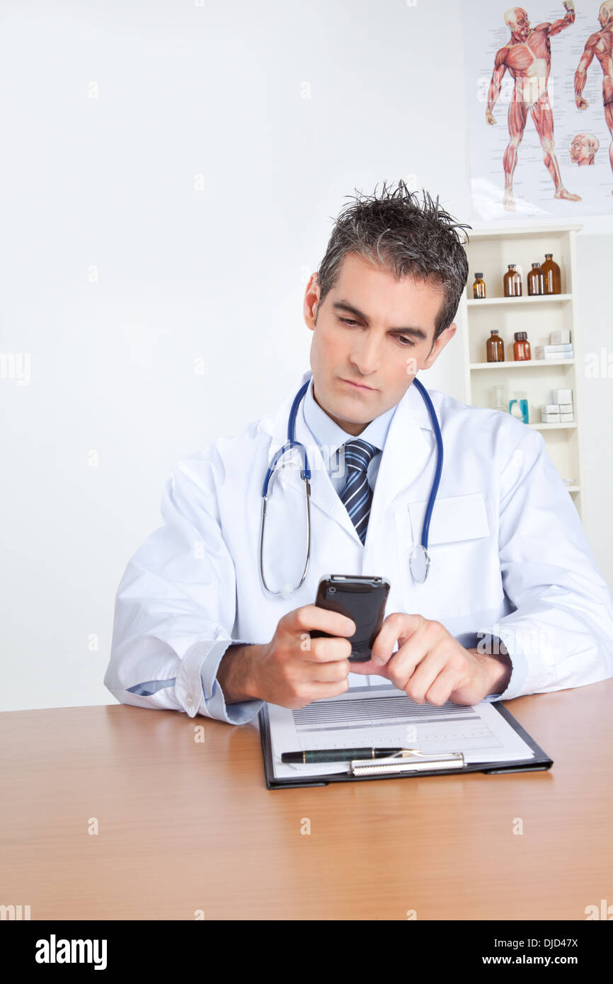 Male Doctor Using Mobile Phone Stock Photo - Alamy