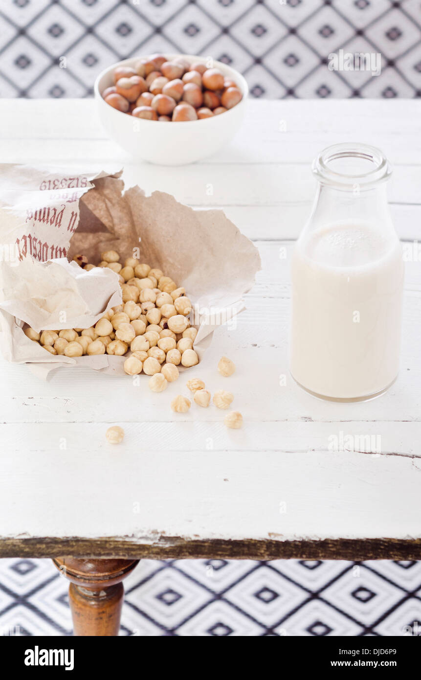 Ingredients for hazel nut milk on wooden table Stock Photo - Alamy