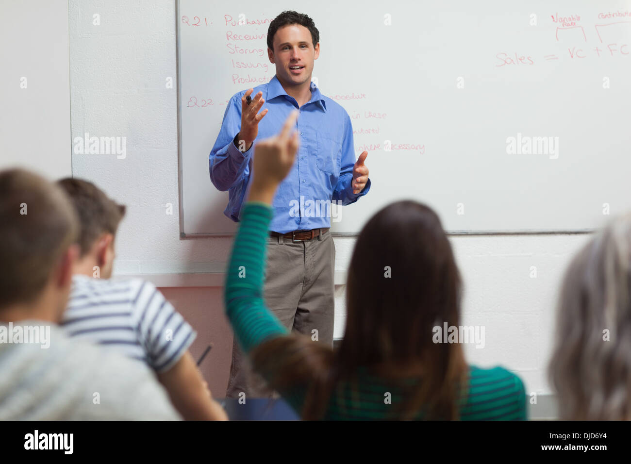 Woman student raising arm hi-res stock photography and images - Alamy