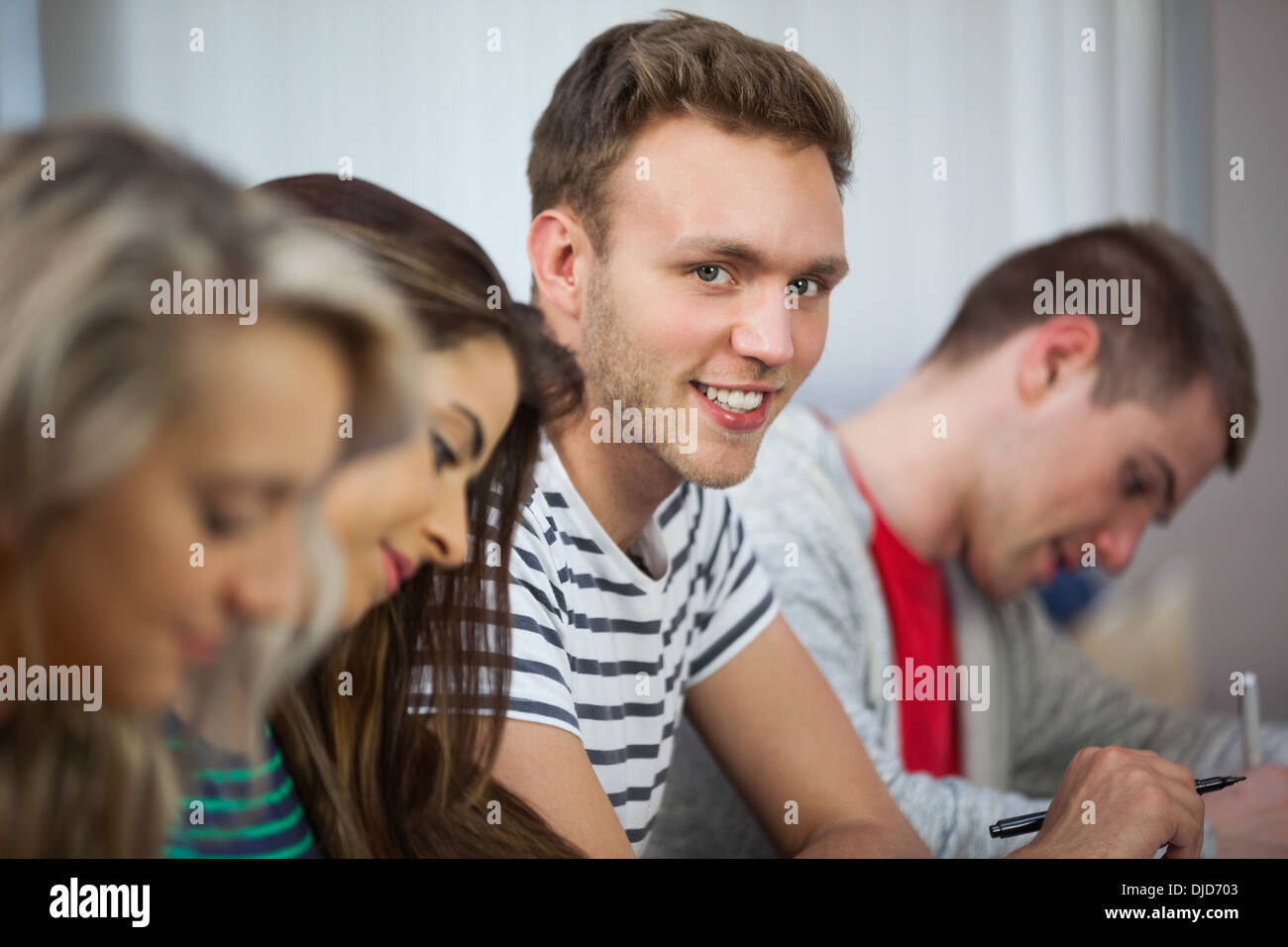 Portrait writing happy student hi-res stock photography and images - Alamy