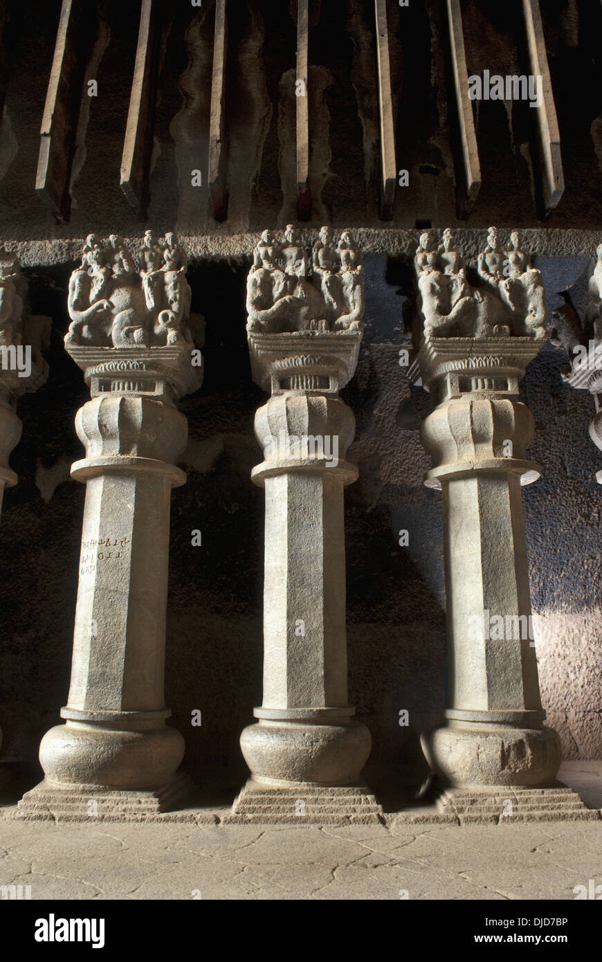 Three pillars- octagonal shaft, inverted bell capital and couples ...