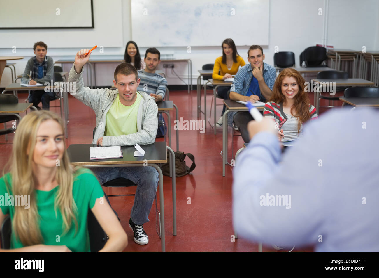 Student raising his hand to ask a question in class Stock Photo - Alamy