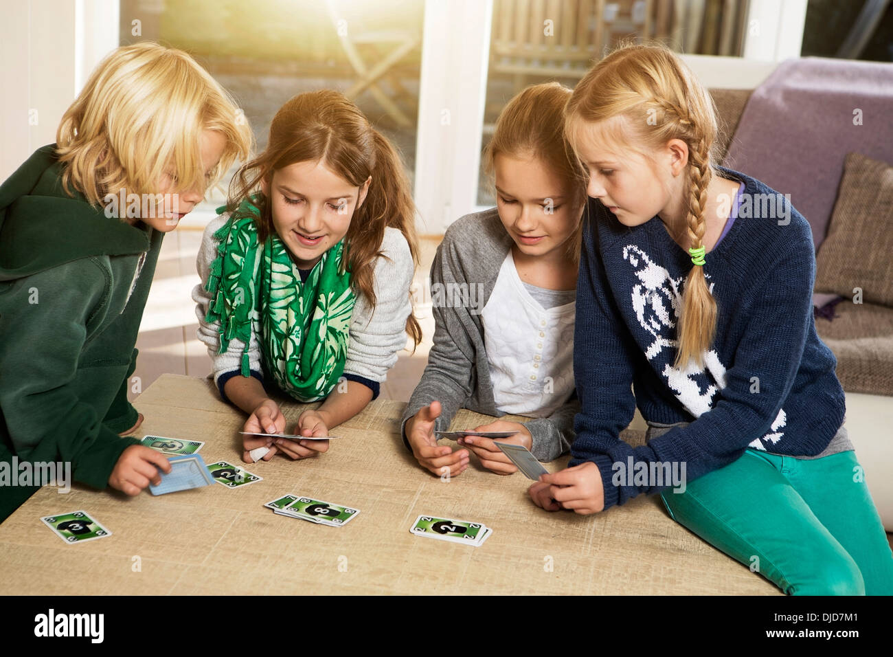 Brother sister playing cards hi-res stock photography and images - Alamy