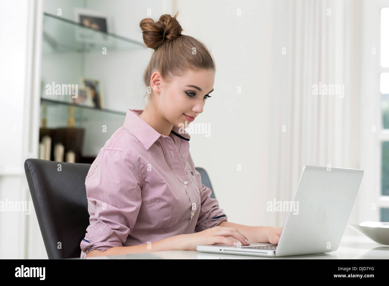 Portrait of teenage girl using laptop Stock Photo - Alamy