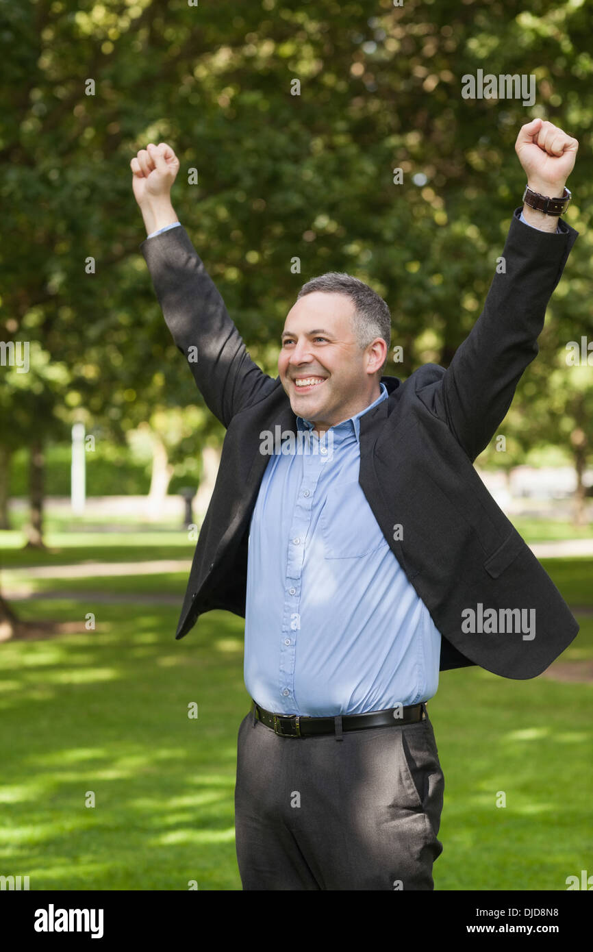 Happy lecturer cheering outside on campus Stock Photo - Alamy