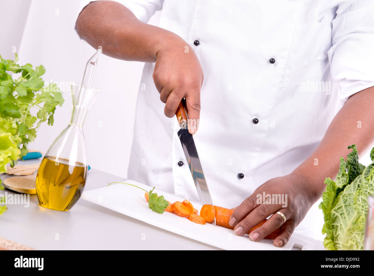 Detail of male chef hands with fruits and vegetables on table Stock ...