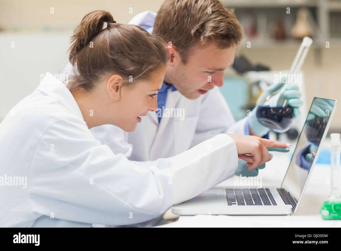 Young students working laptop computer hi-res stock photography and ...
