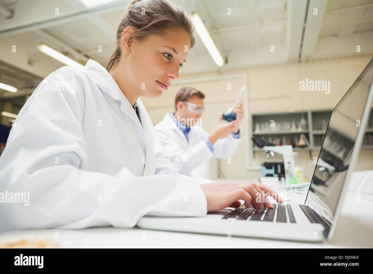 Male student typing laptop hi-res stock photography and images - Alamy