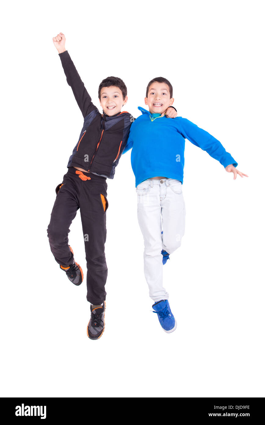 Young boy jumping isolated in white Stock Photo - Alamy