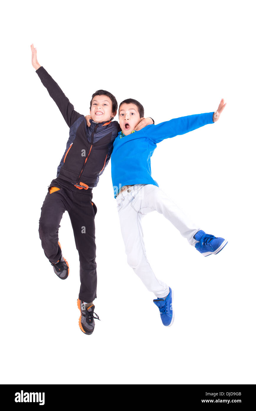Young boy jumping isolated in white Stock Photo - Alamy