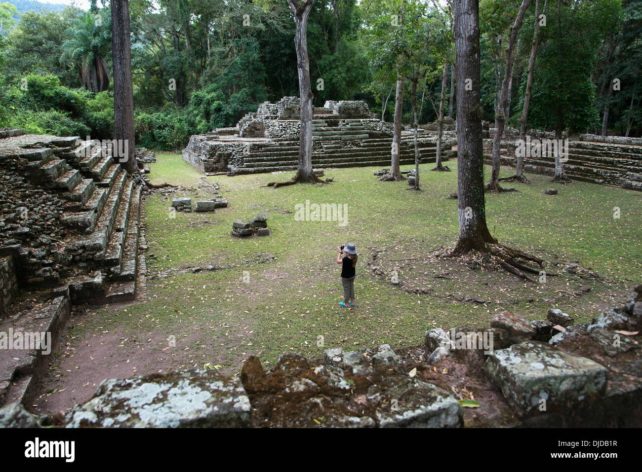 A Girl Photographs A Maya Civilization At Copan Ruins; Copan, Honduras ...