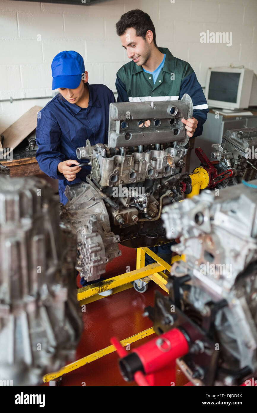 Trainee and instructor checking engine Stock Photo - Alamy