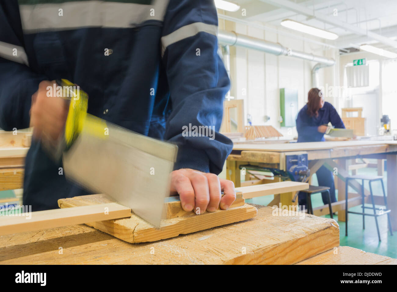 Woman sawing wood hi-res stock photography and images - Alamy