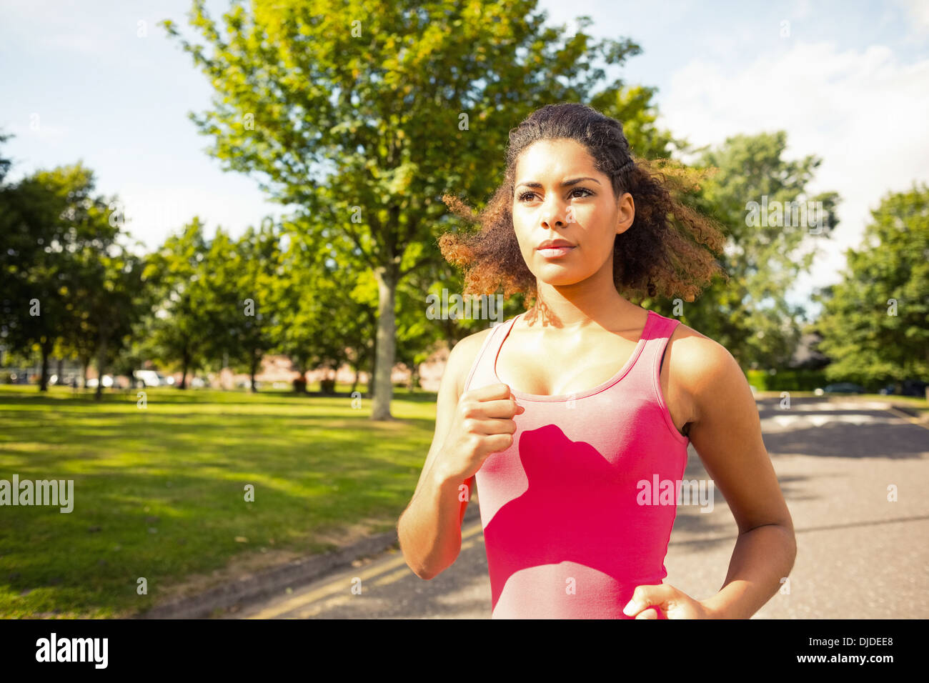 Beautiful healthy woman jogging on pathway in park Stock Photo - Alamy