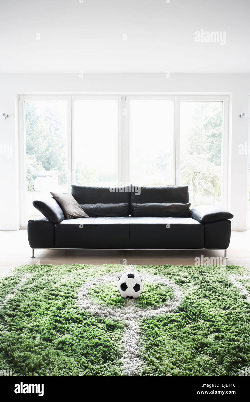 Germany, Cologne, Football field in living room Stock Photo - Alamy