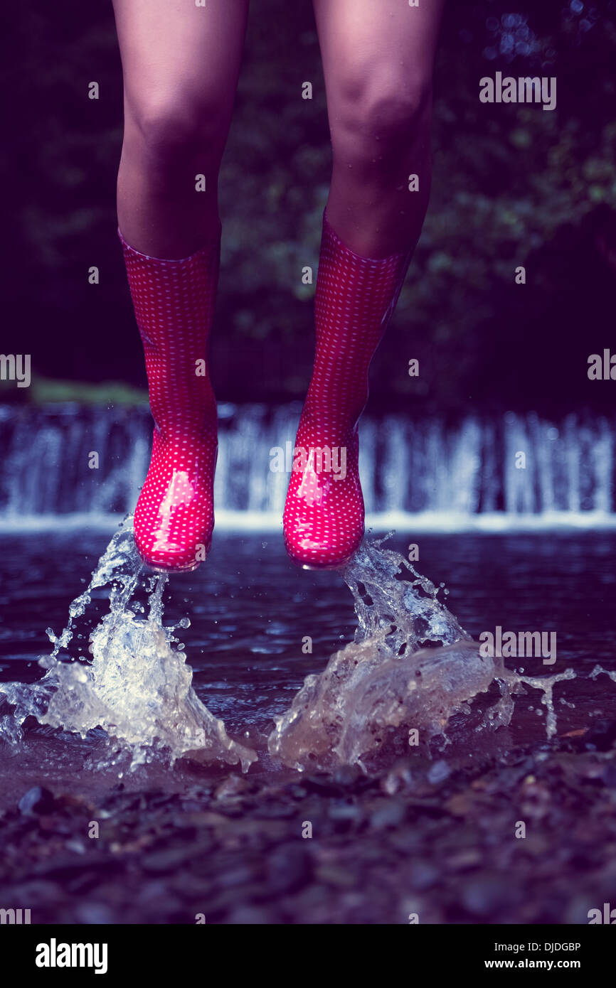 Playful woman jumping in hi-res stock photography and images - Alamy
