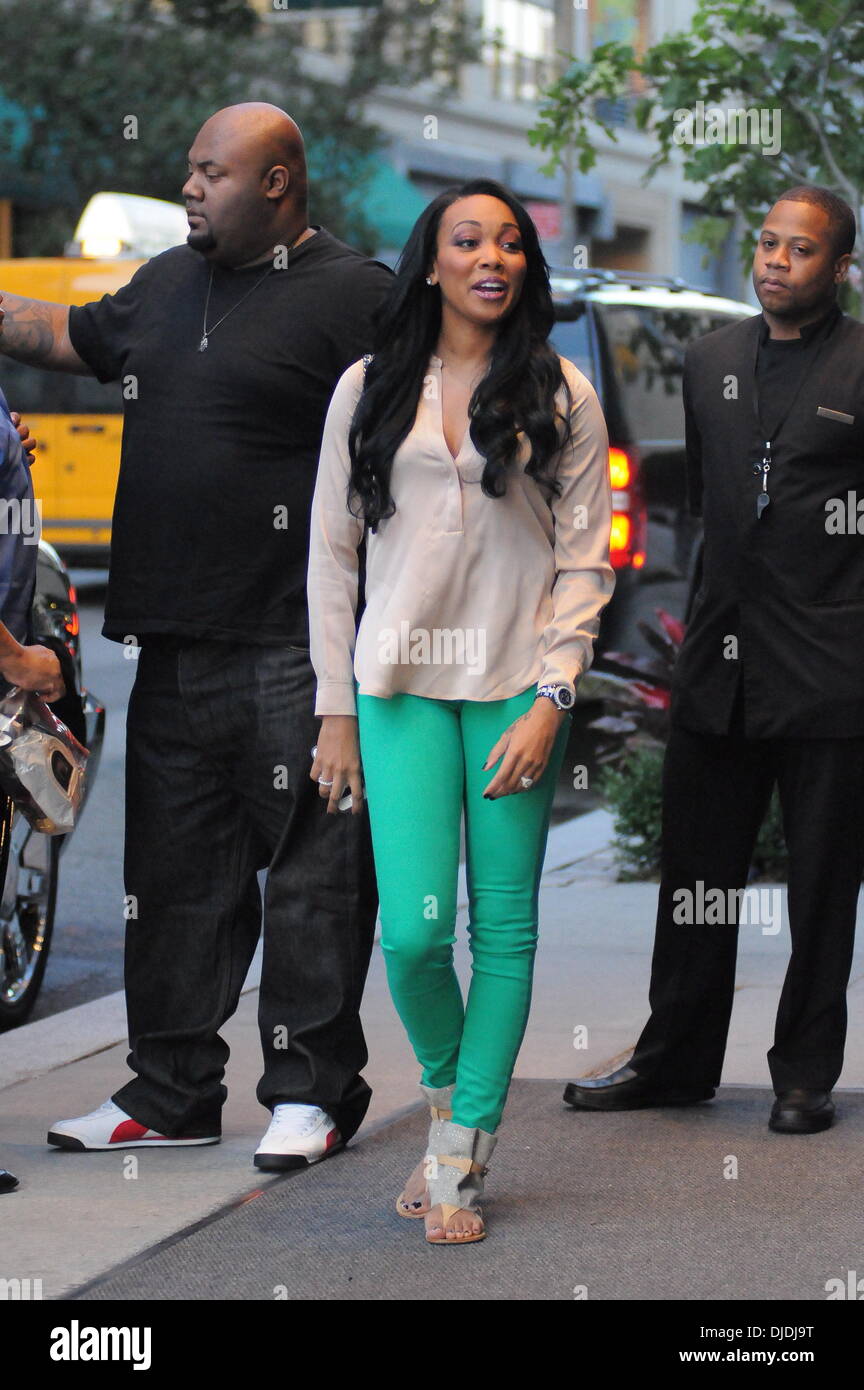 Singer Monica poses for photographers outside of the Trump Soho Hotel ...