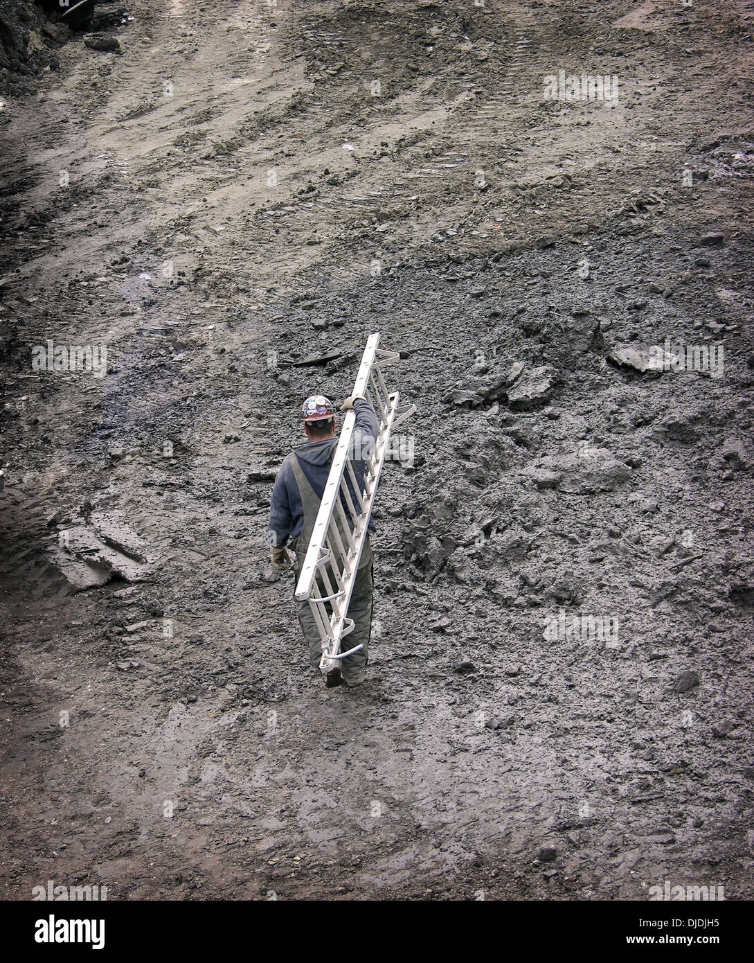 A workman carry a ladder at a construction site in Downtown Chicago ...