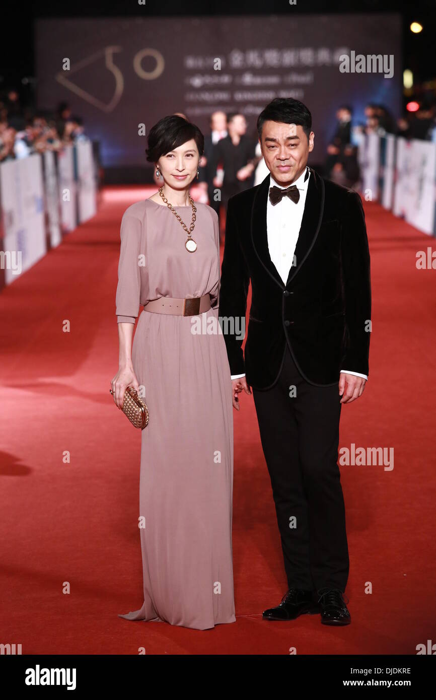 Taipei, China. 23rd Nov, 2013. Sean Andy and wife Amy Kwok arrive at ...