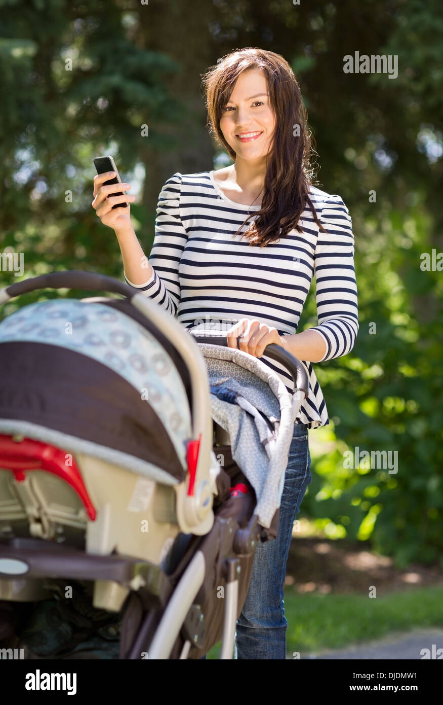 Woman Pushing Pram Phone High Resolution Stock Photography and Images ...
