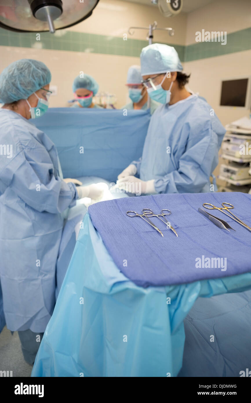 Surgeons Operating in Surgical Theater Stock Photo - Alamy