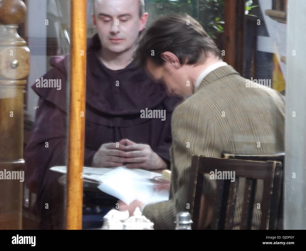 Matt Smith and Barnaby Edwards Matt Smith filming a scene in a cafe with a hooded Barnaby ...