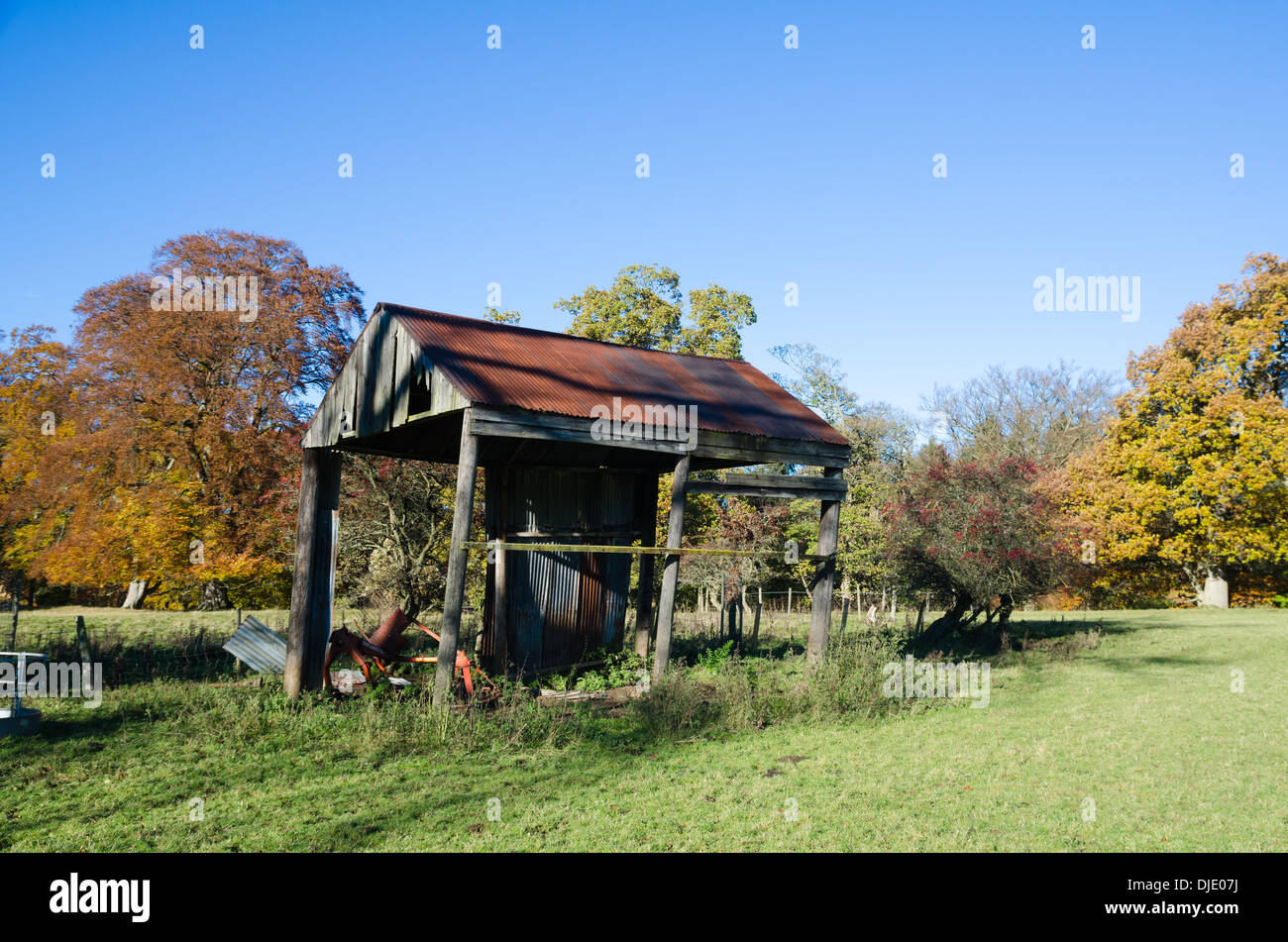 Leaning pole barn thats seen better days Stock Photo - Alamy