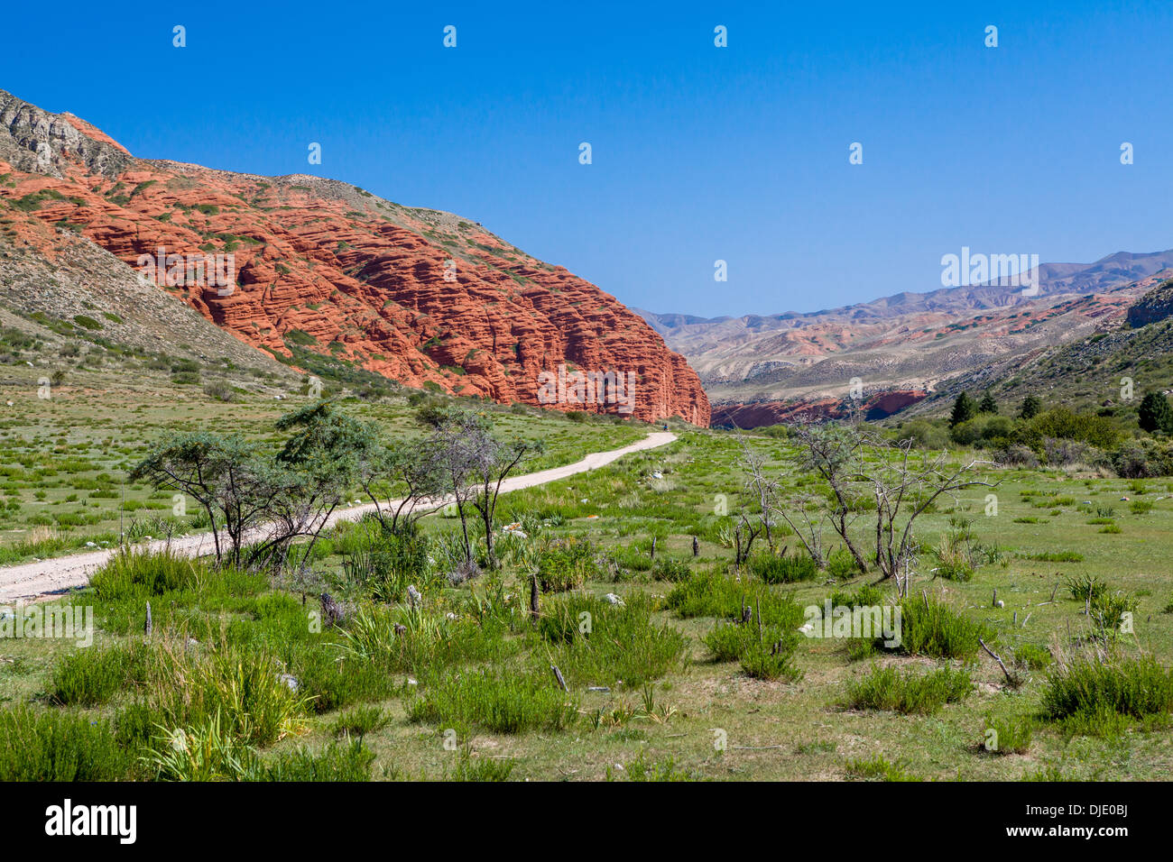 Road and red rocks in Kirgizstan Stock Photo - Alamy
